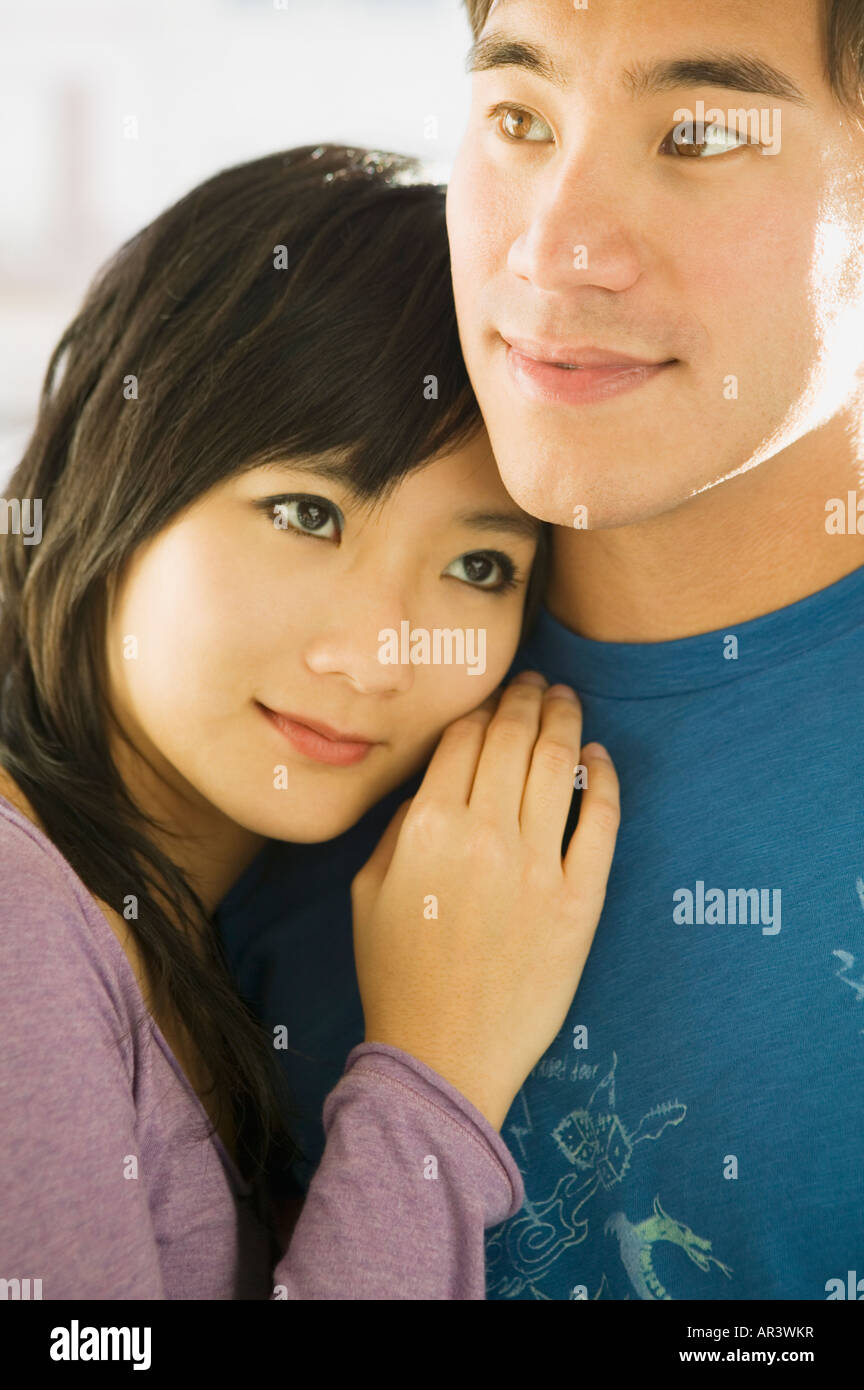 Asian couple hugging Stock Photo - Alamy