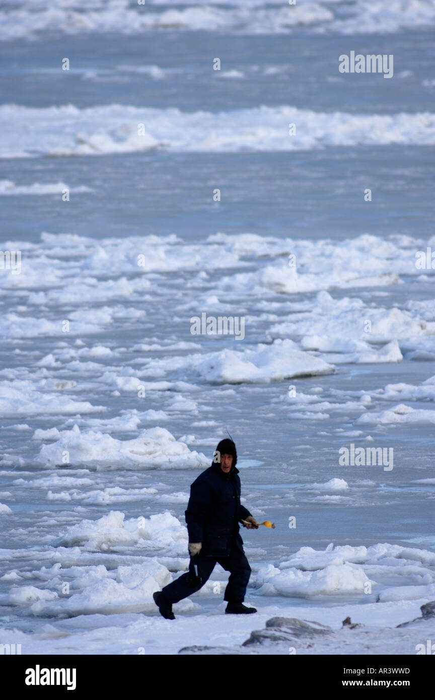 inupiat elder Jimmy Soplu along the Arctic coast during fall freeze up ...