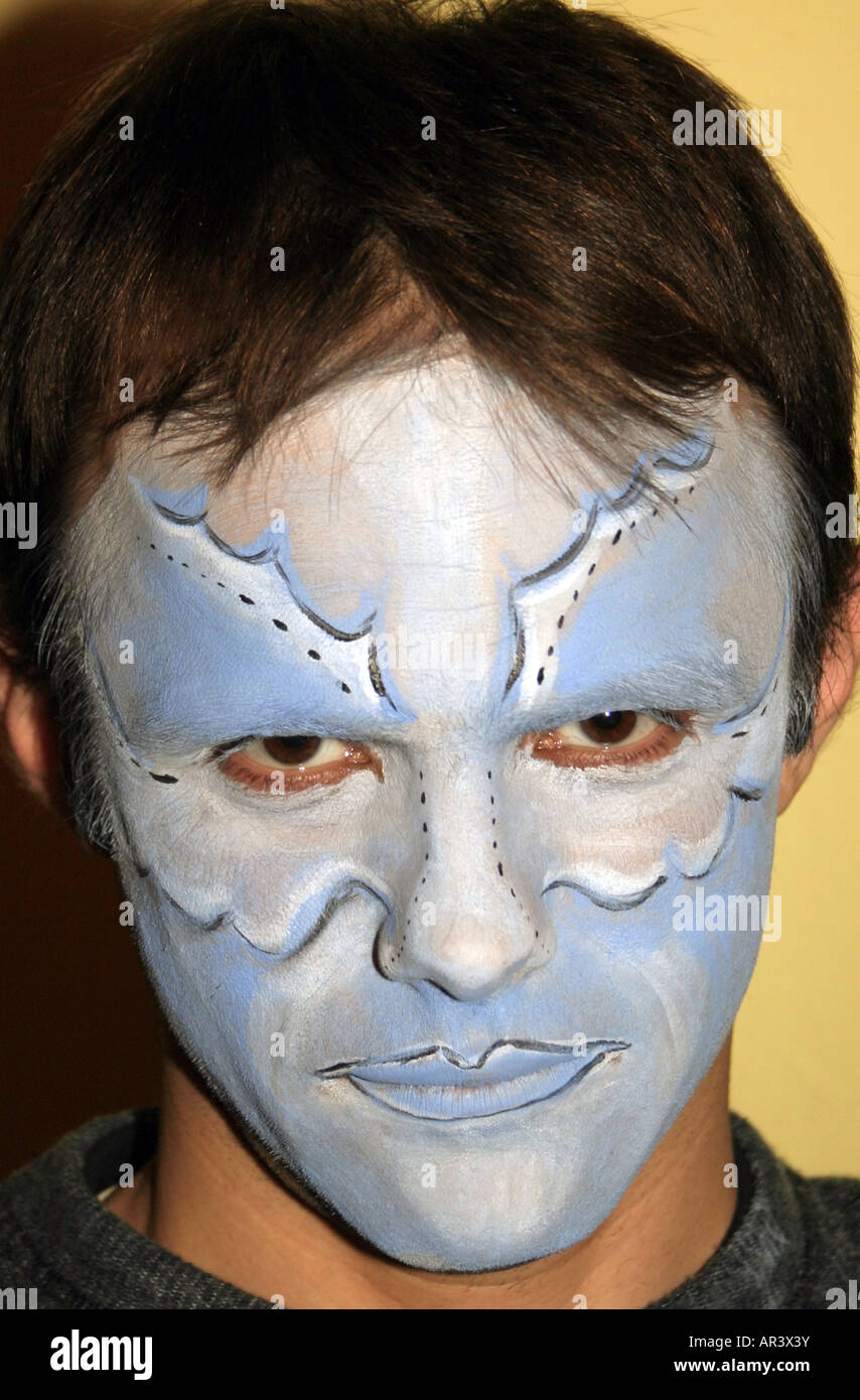Evil look of a man with painted face Stock Photo - Alamy