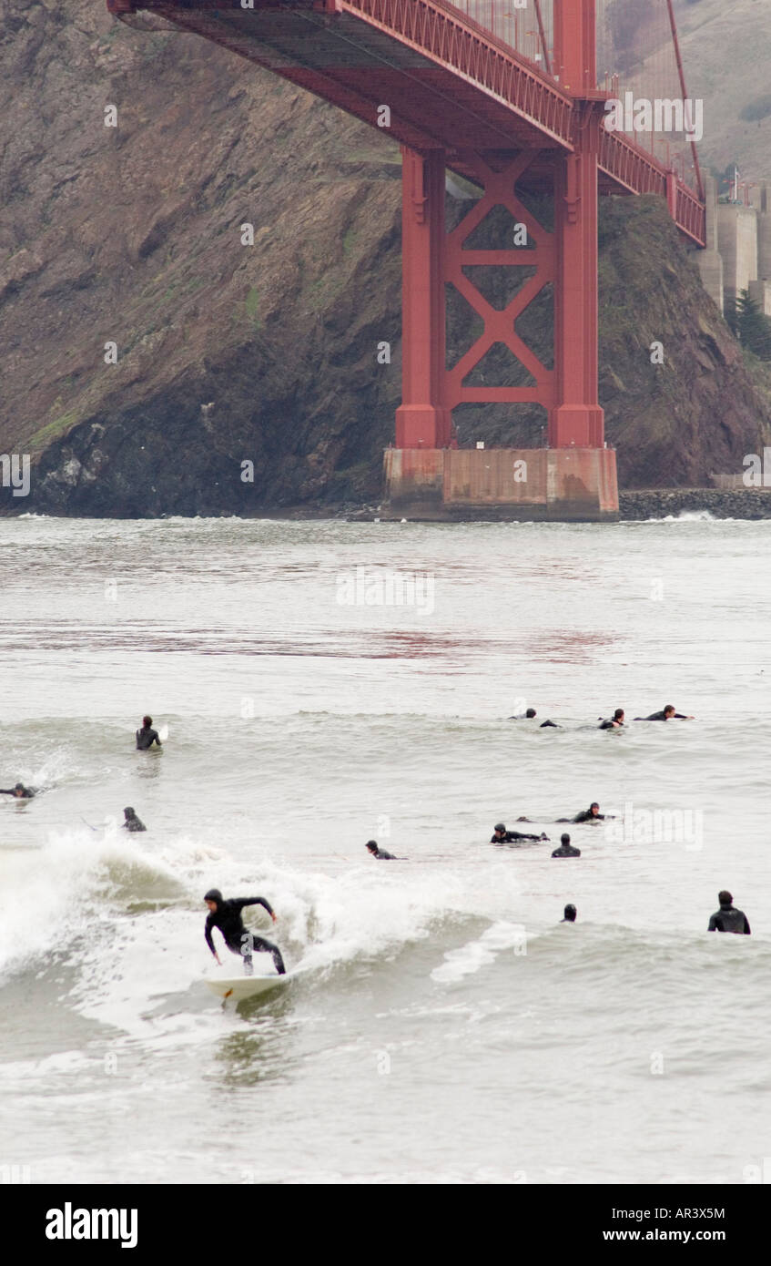 Surfing beneath the Golden Gate Bridge in San Francisco California ...