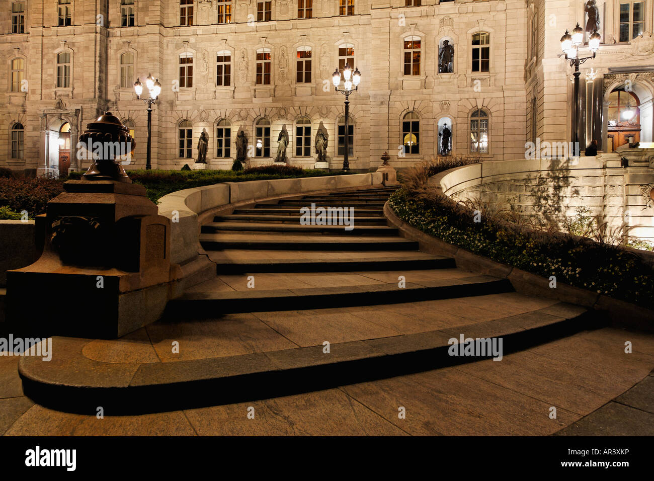 Nighttime View of the Parliament building statues on the front facade ...