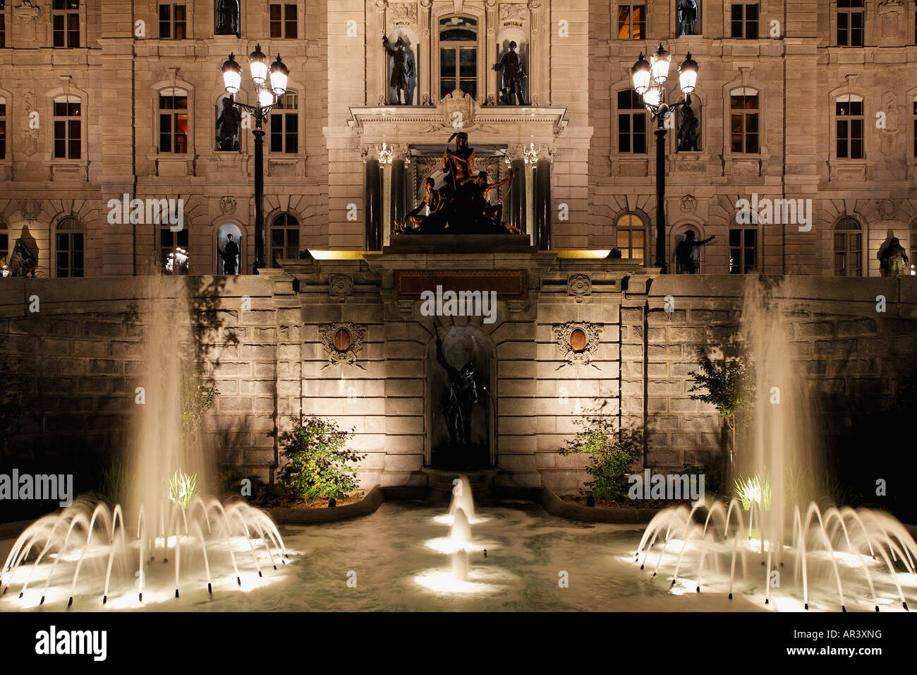 Nighttime View of the Parliament building statues on the front facade ...