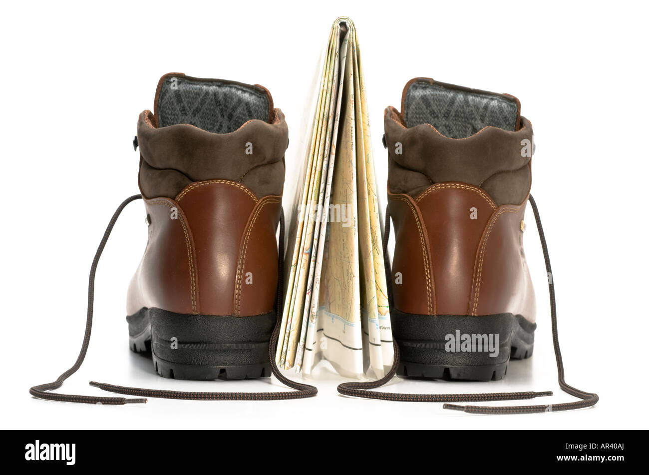 The rear of a pair of walking boots and a folded map Stock Photo - Alamy