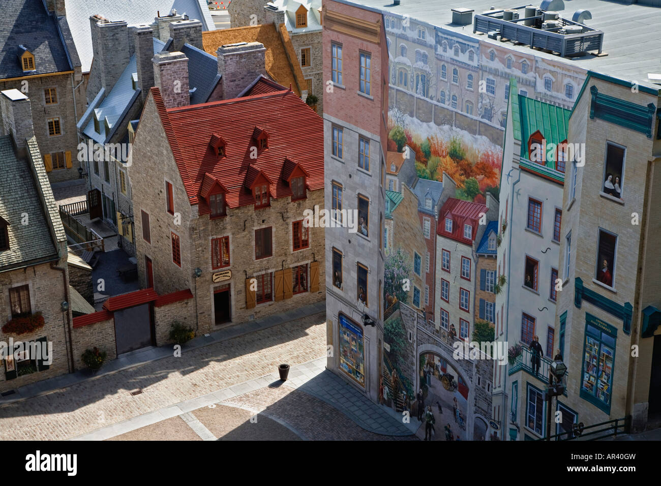 Fresque des Quebecois with surrounding stone buildings in Lower Town of ...
