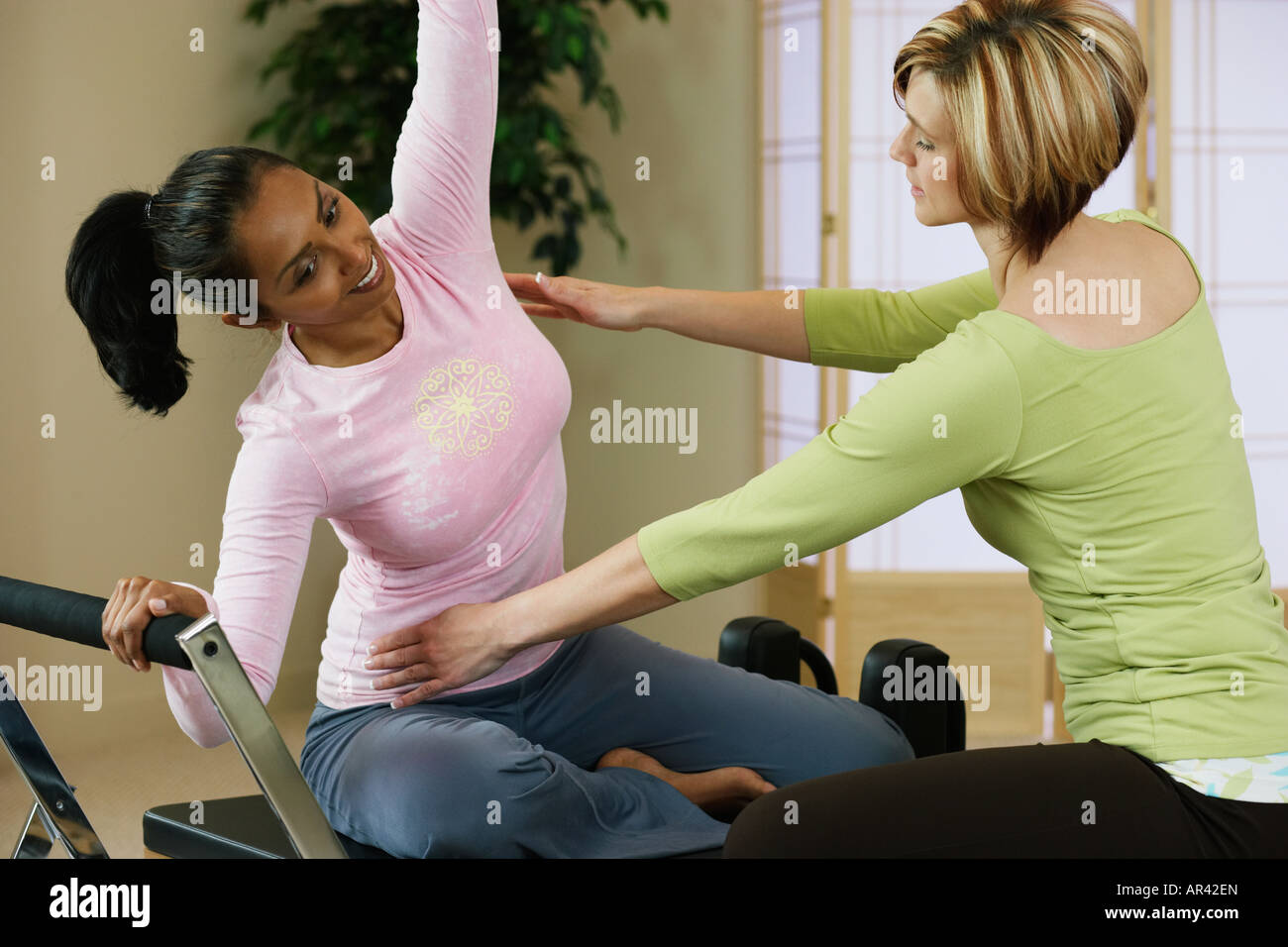 Indian woman exercising with personal trainer Stock Photo - Alamy
