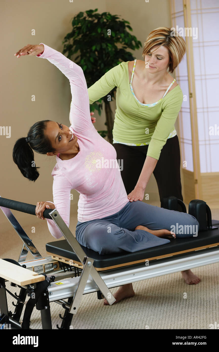 Indian woman exercising with personal trainer Stock Photo - Alamy