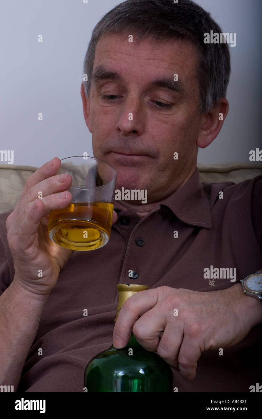 depressed man suffering from drink problems Stock Photo - Alamy