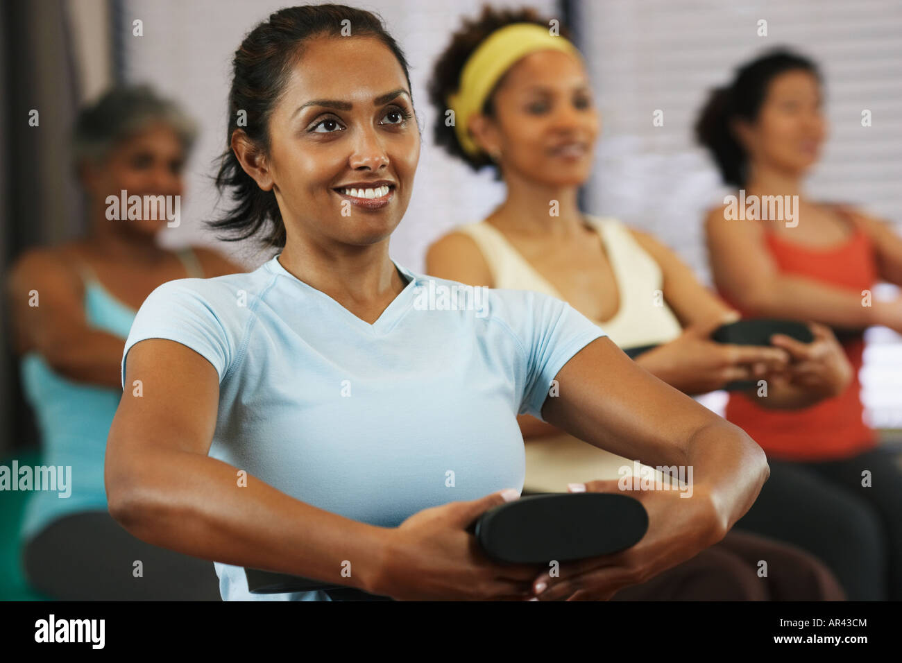 Multi-ethnic women in exercise class Stock Photo - Alamy