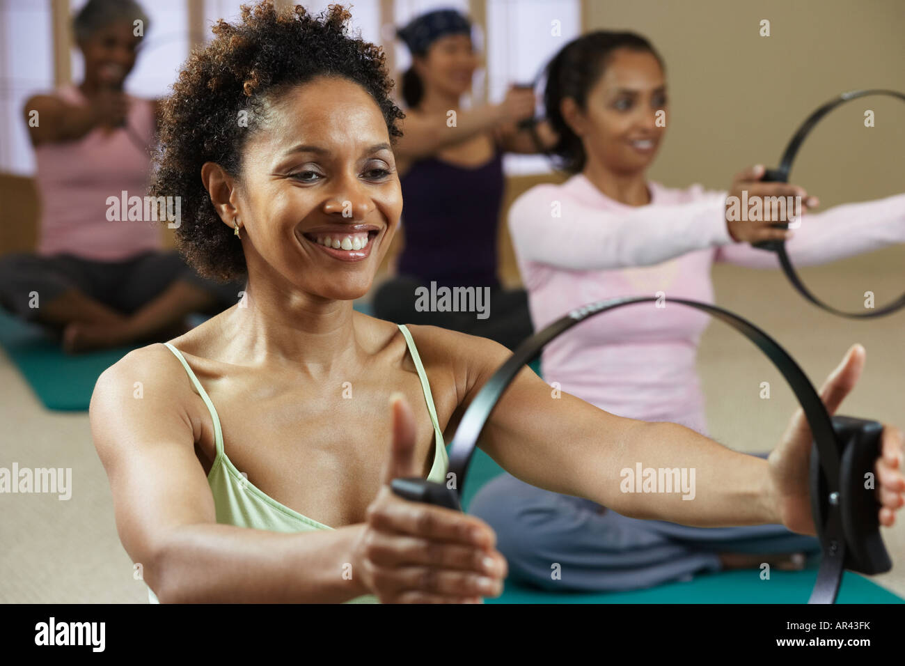 Multi-ethnic women in exercise class Stock Photo - Alamy