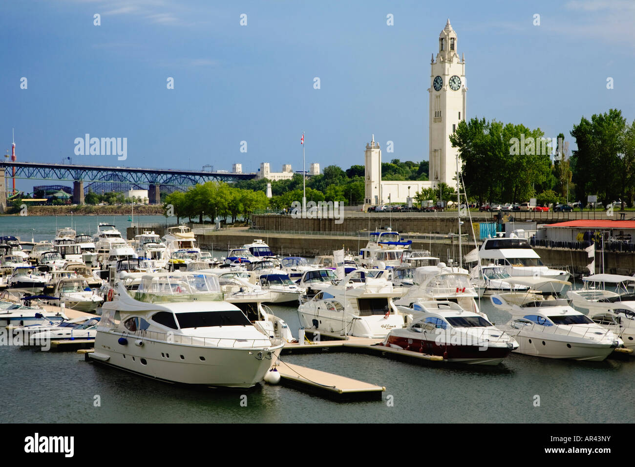 Pleasure boats docked near the clock tower The clock tower marks the ...