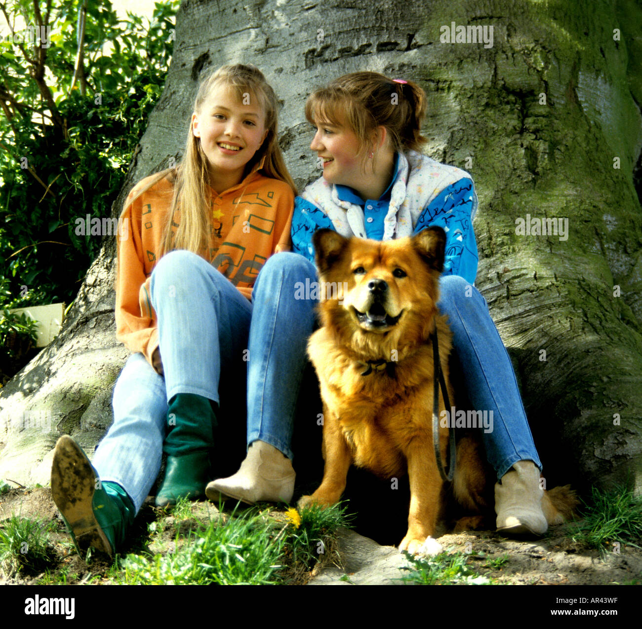 Two Young Girls with dog in Leiden Netherlands Holland Stock Photo - Alamy