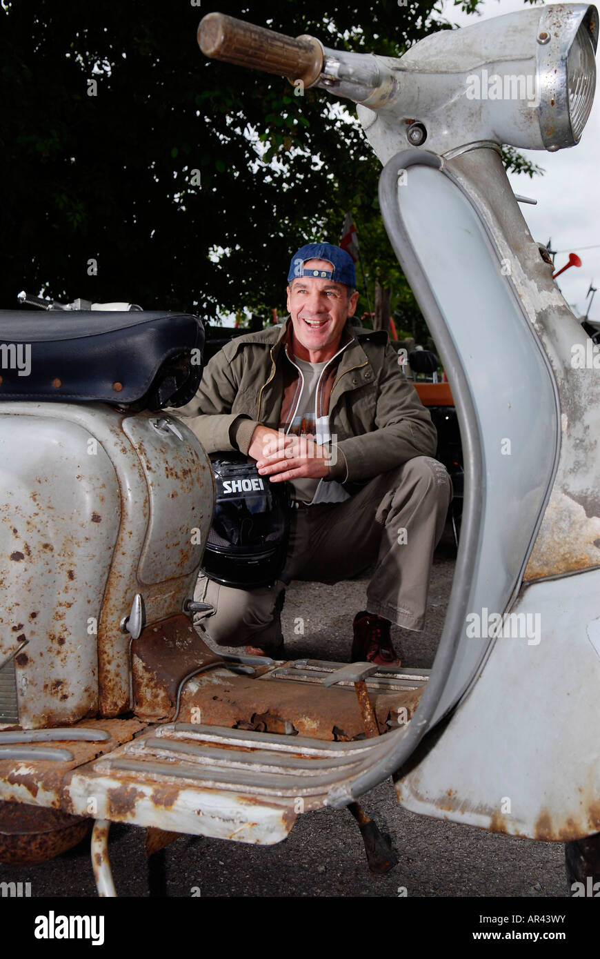 rusty vespa scooter and owner Stock Photo - Alamy