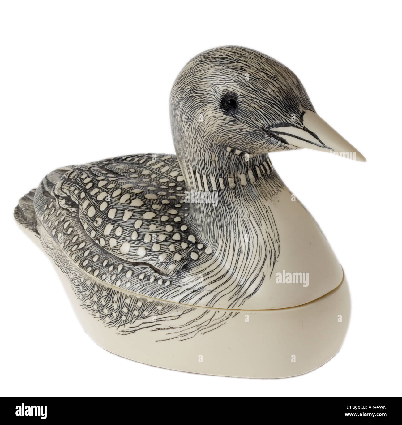 Handmade scrimshaw carved loon Stock Photo - Alamy