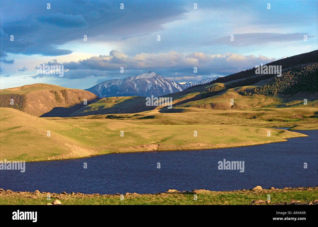 Mongun-Taiga Mountain (3717 meters) and Mogen-Buren River at sunset ...