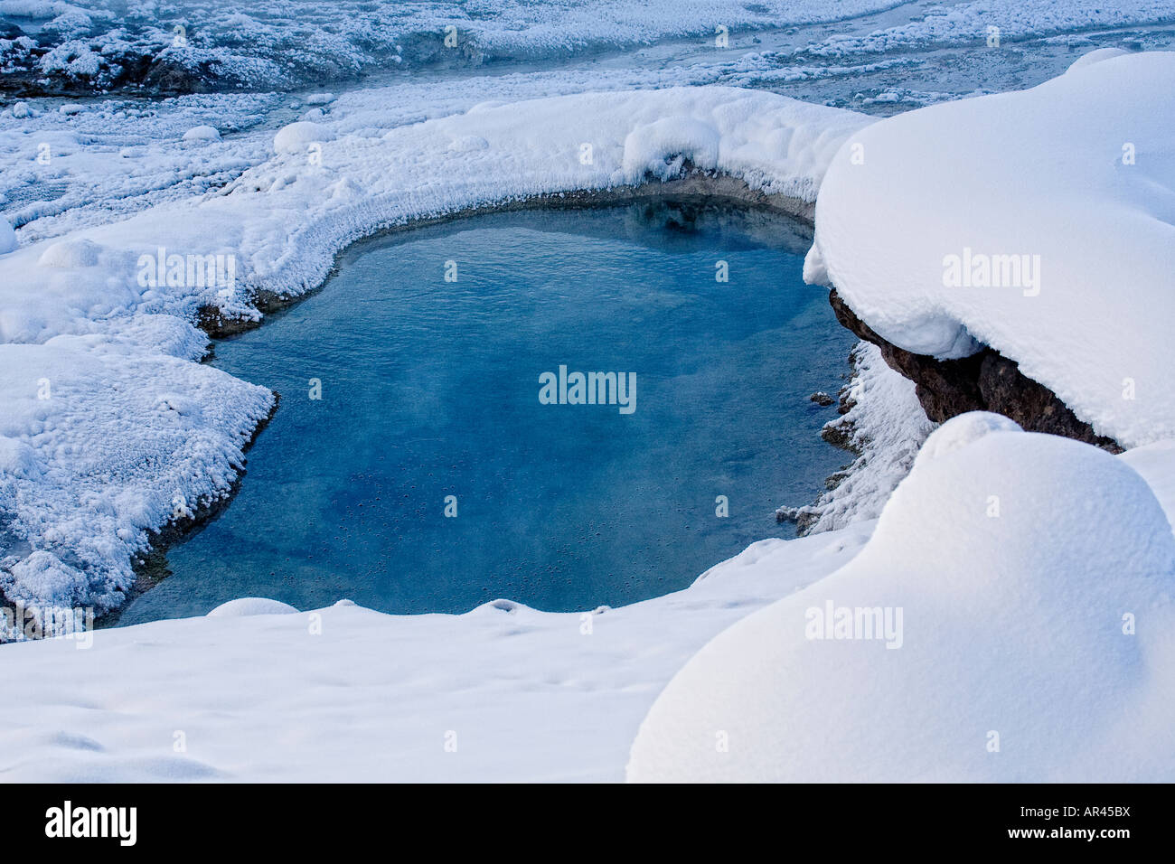 Geyser yellowstone snow hi-res stock photography and images - Alamy