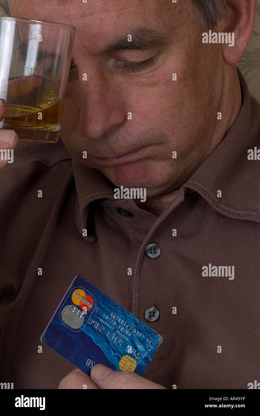 Depressed man crying over money hi-res stock photography and images - Alamy