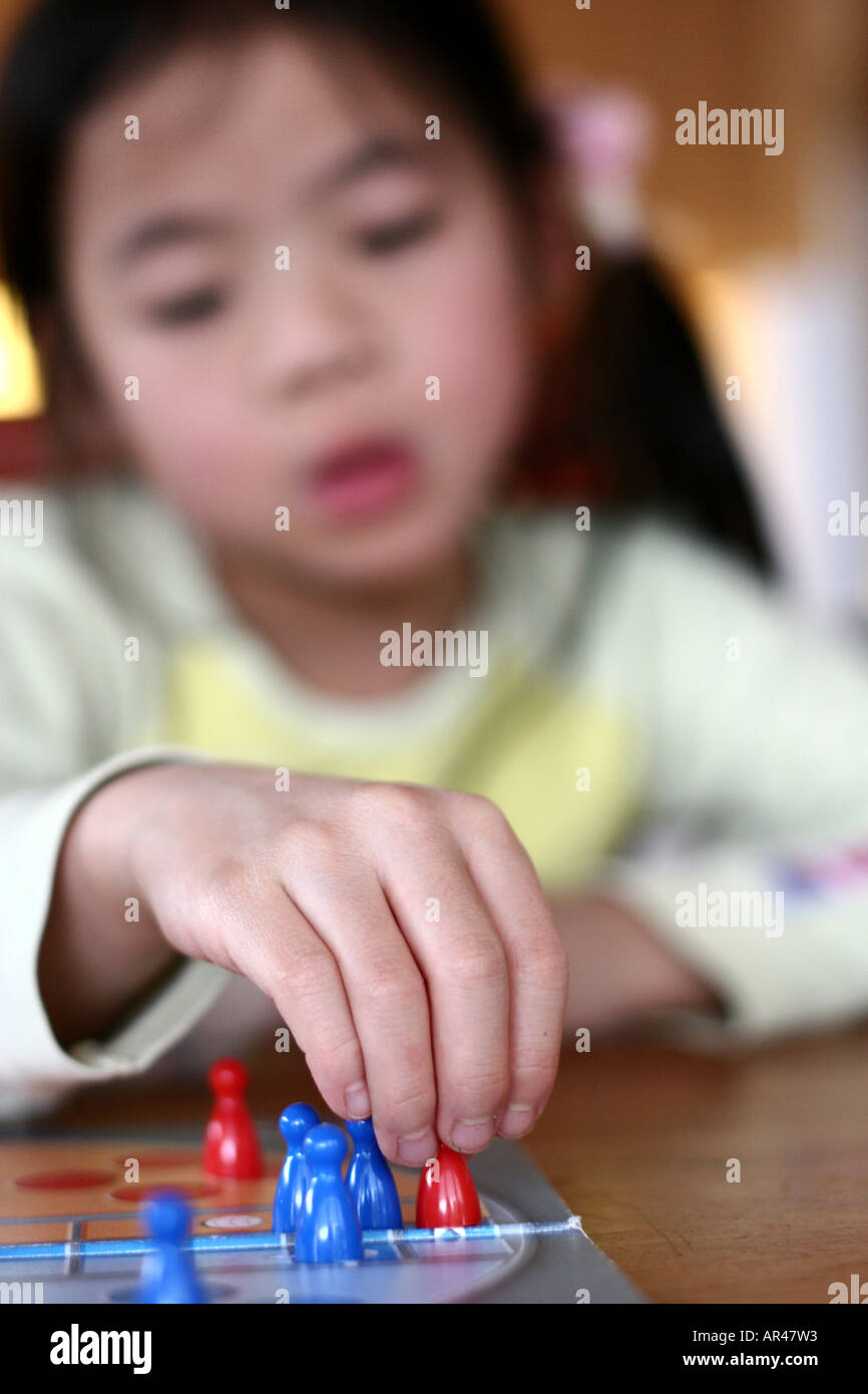 child playing indoor game Stock Photo - Alamy