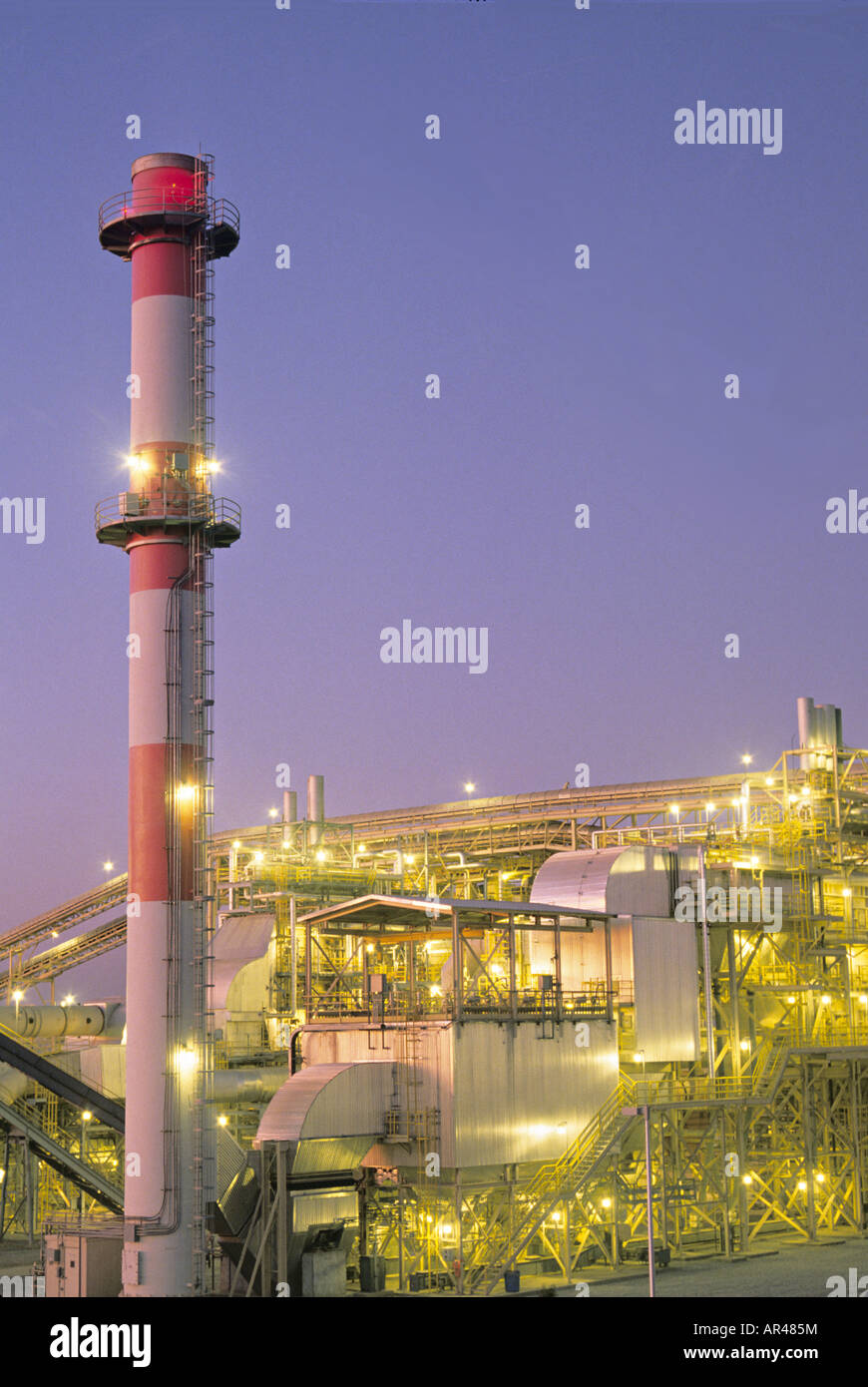 Sunset lighting electrical generating plant California Stock Photo - Alamy
