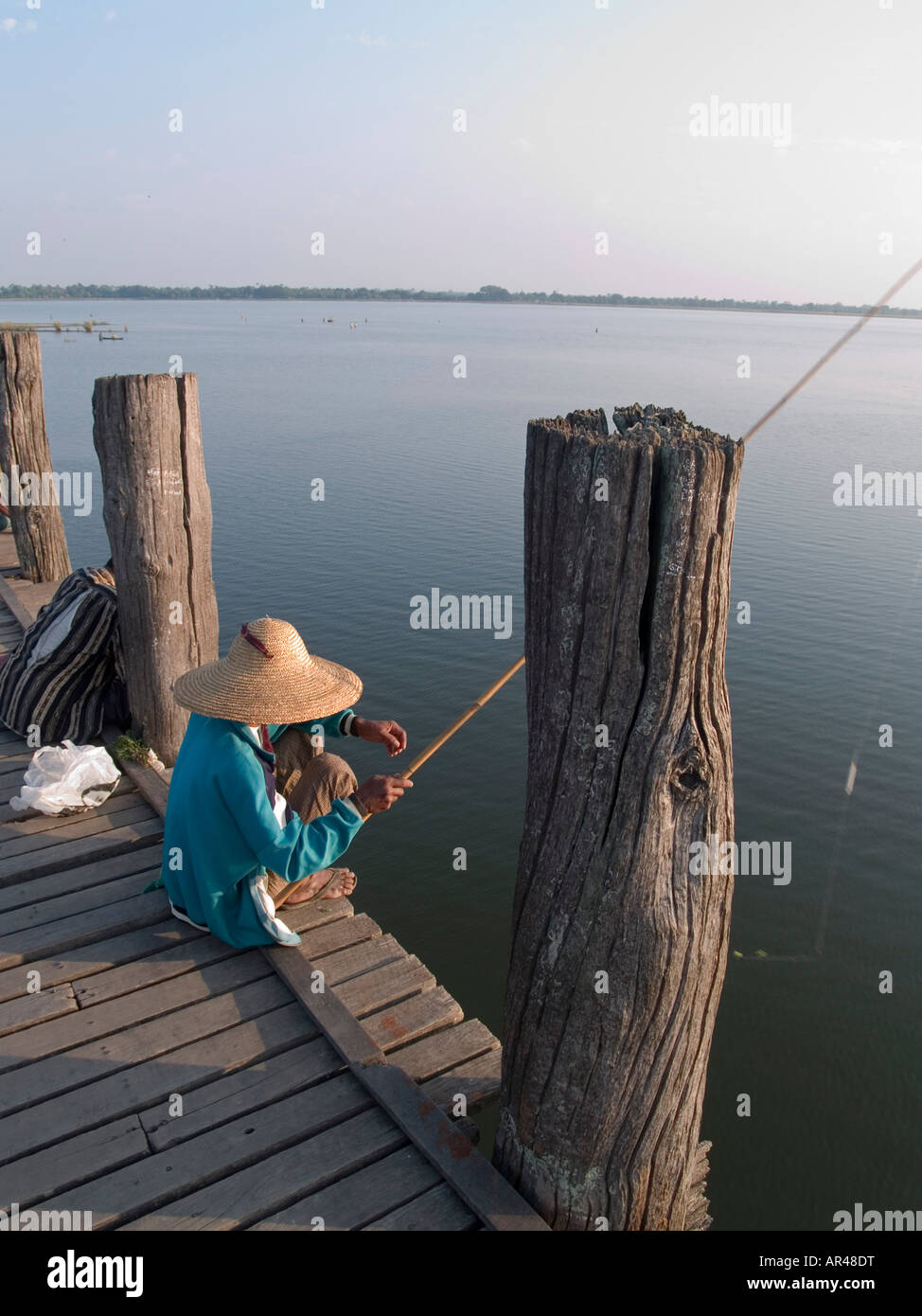 fishing off the U Bein bridge longest teak bridge in the world Stock ...