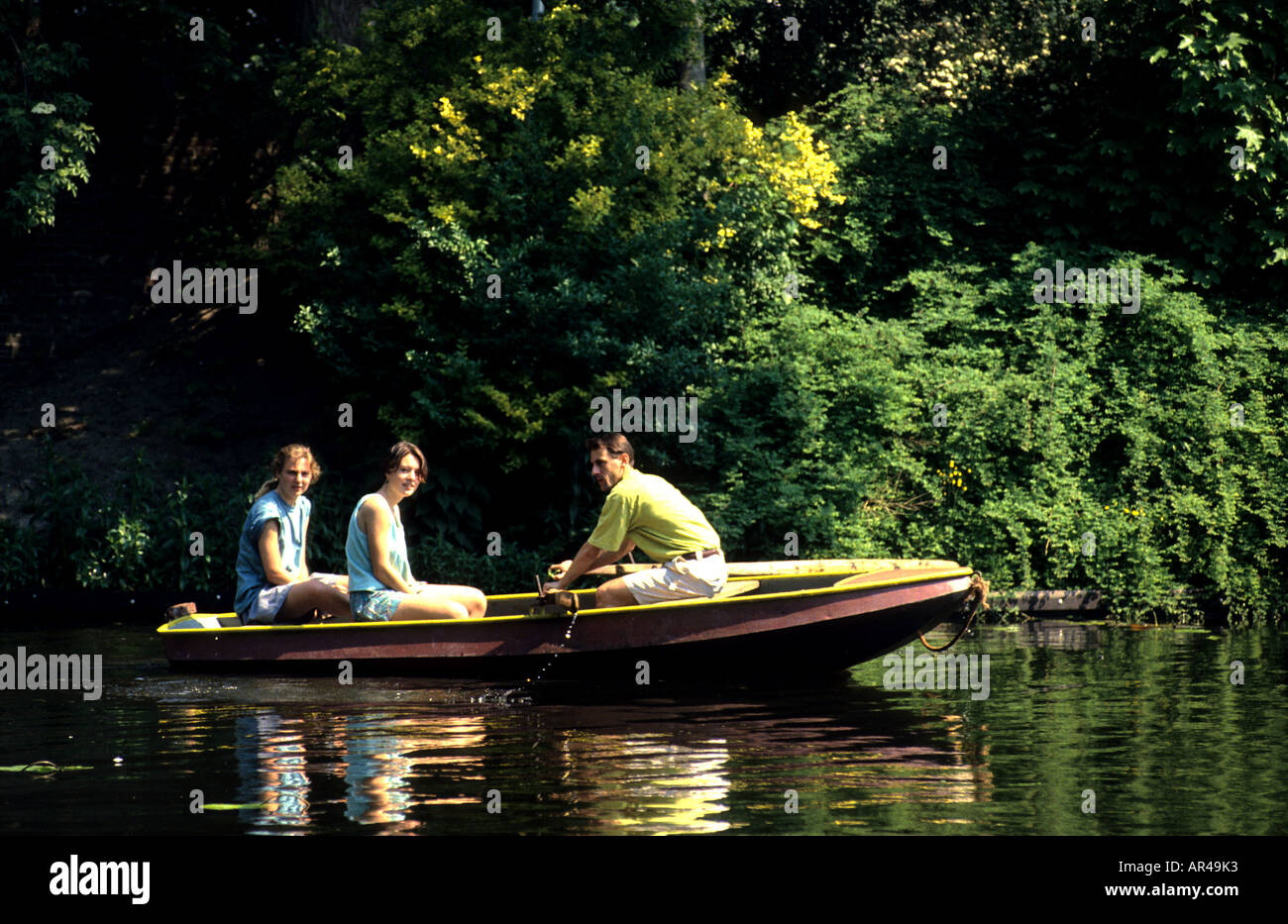 Old man rowing boat hi-res stock photography and images - Alamy