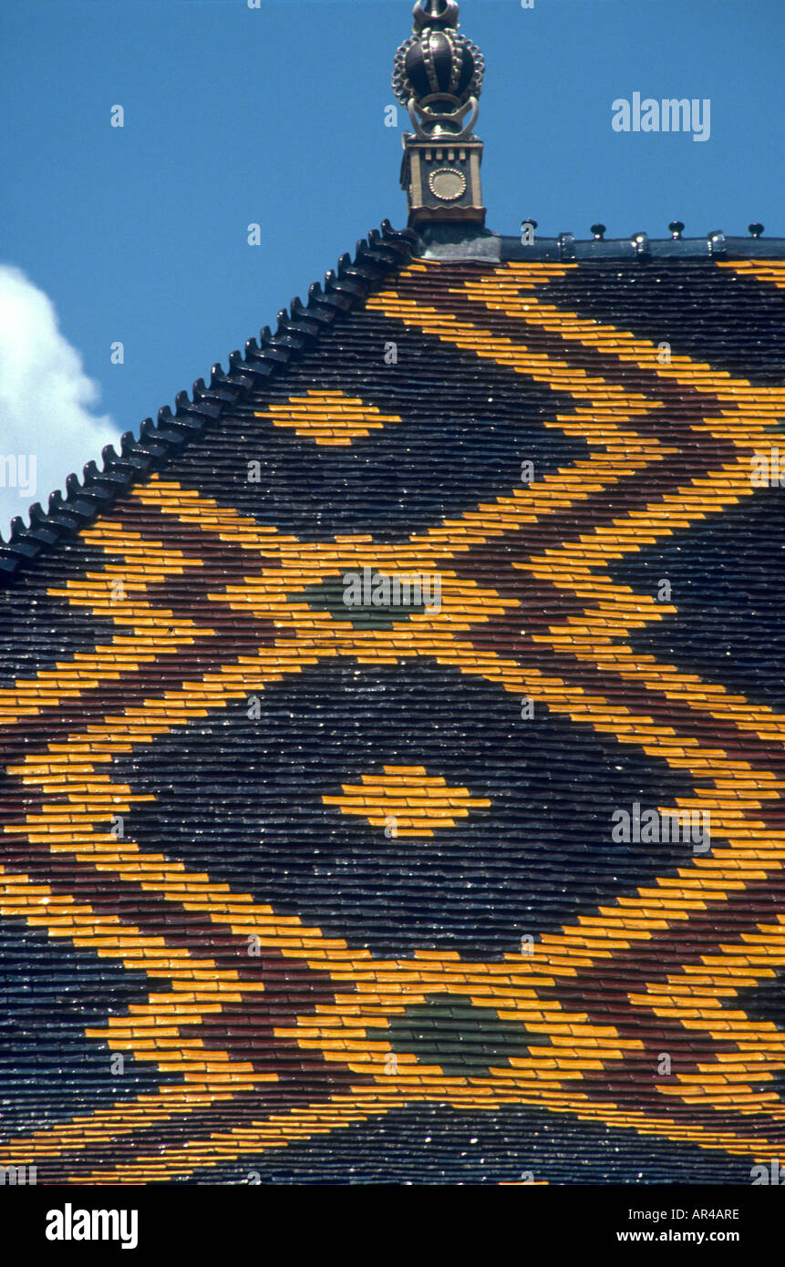 Typically coloured traditional patterned,tiled roof in Beaune,France ...