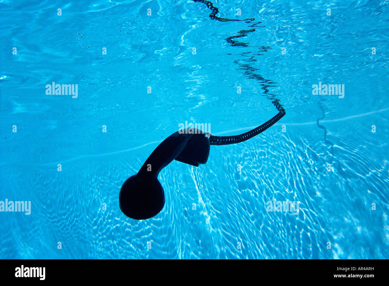 A telephone receiver in a swimming pool Stock Photo - Alamy