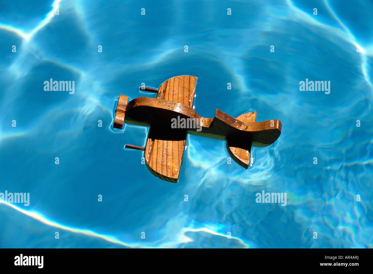 A wooden aircraft on a swimming pool Stock Photo - Alamy