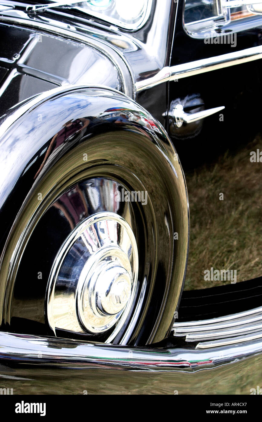 A side angled view of a black vintage British car showing the running ...