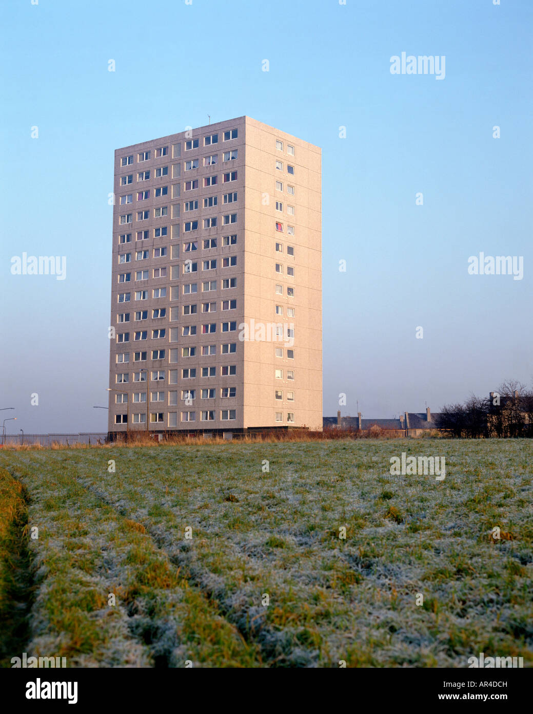 Apartment building near field Stock Photo - Alamy