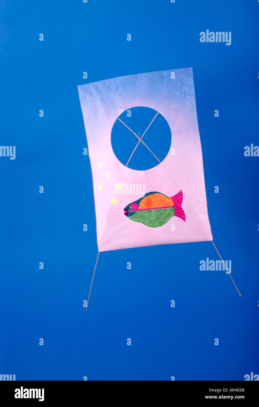 Japanese paper and bamboo two stick kite with fish design in flight ...