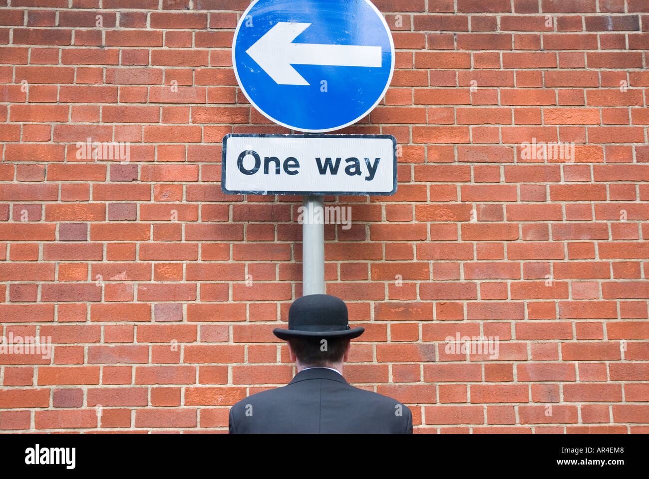 One way sign,oneway sign,man looking at it,brickwall,bowler hat,help ...