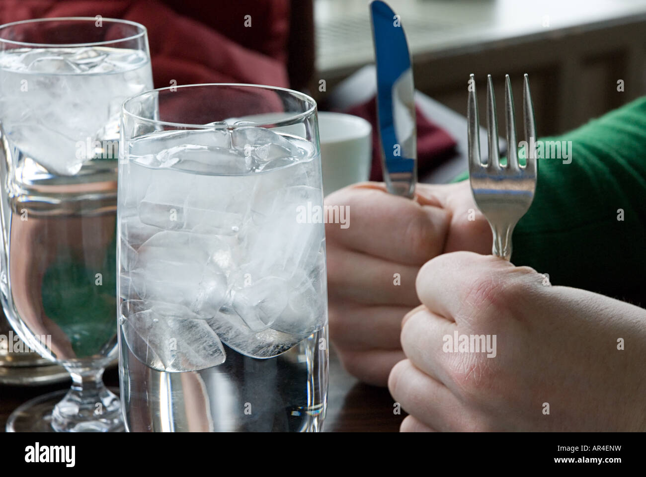 Person with knife and fork Stock Photo - Alamy