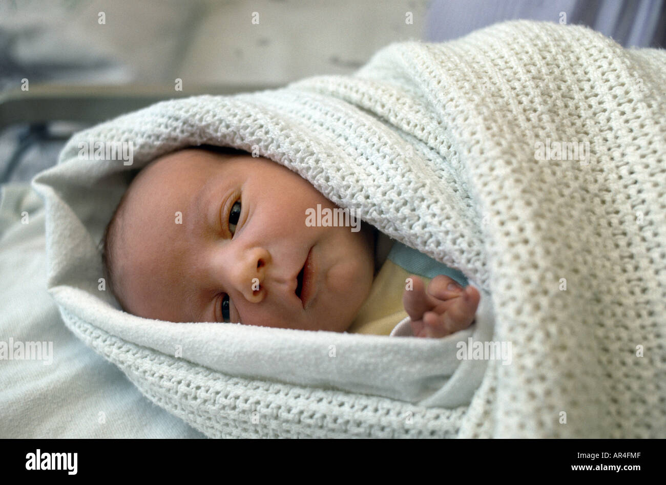 new-born baby swaddled Stock Photo - Alamy