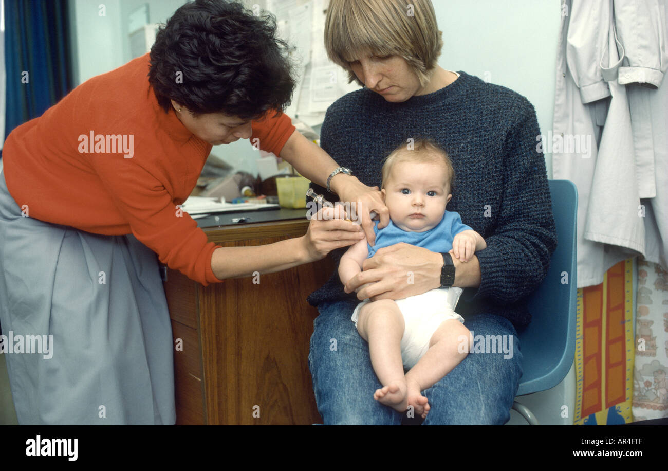 triple injection vaccination for four month baby Stock Photo - Alamy