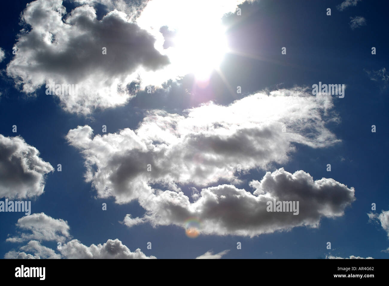 Sun shinning through the clouds in south east of london hi-res stock ...
