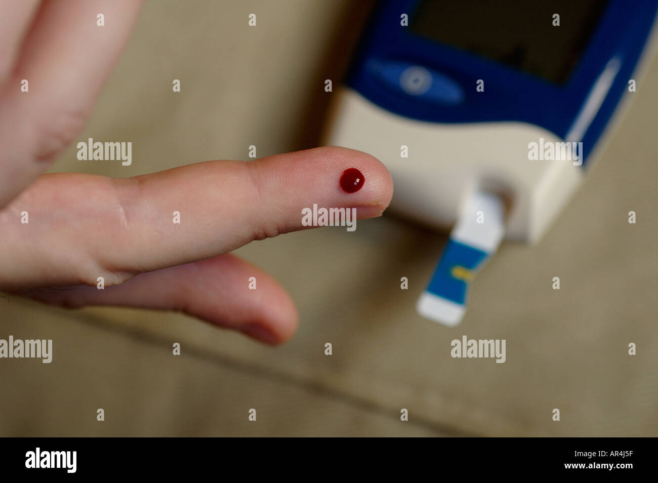 Finger prick for diabetic blood test using a blood-sampling device ...