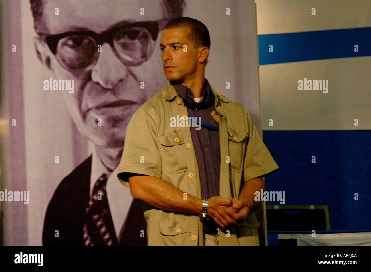 Israeli "Shabak" bodyguard stand guard in front of a poster with ...