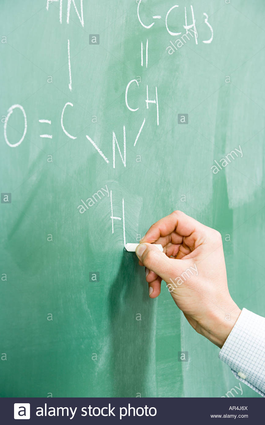 Teacher Writing On Blackboard Stock Photos & Teacher Writing On ...