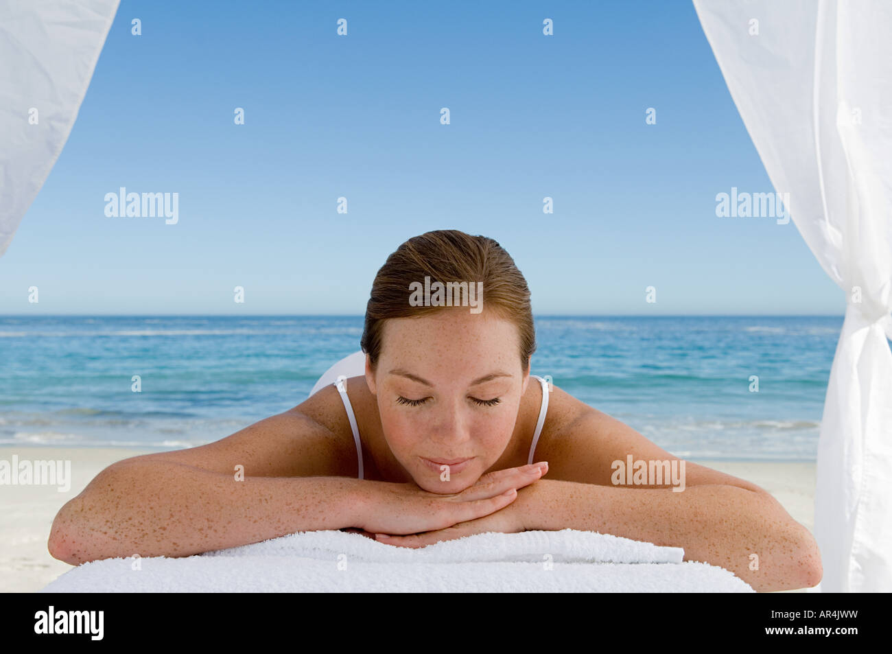 Young woman lying on front Stock Photo - Alamy
