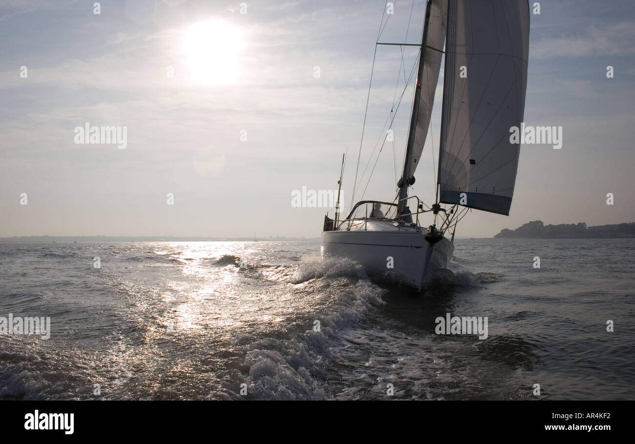 colour image off looking across the sea with a boat sailing in the ...