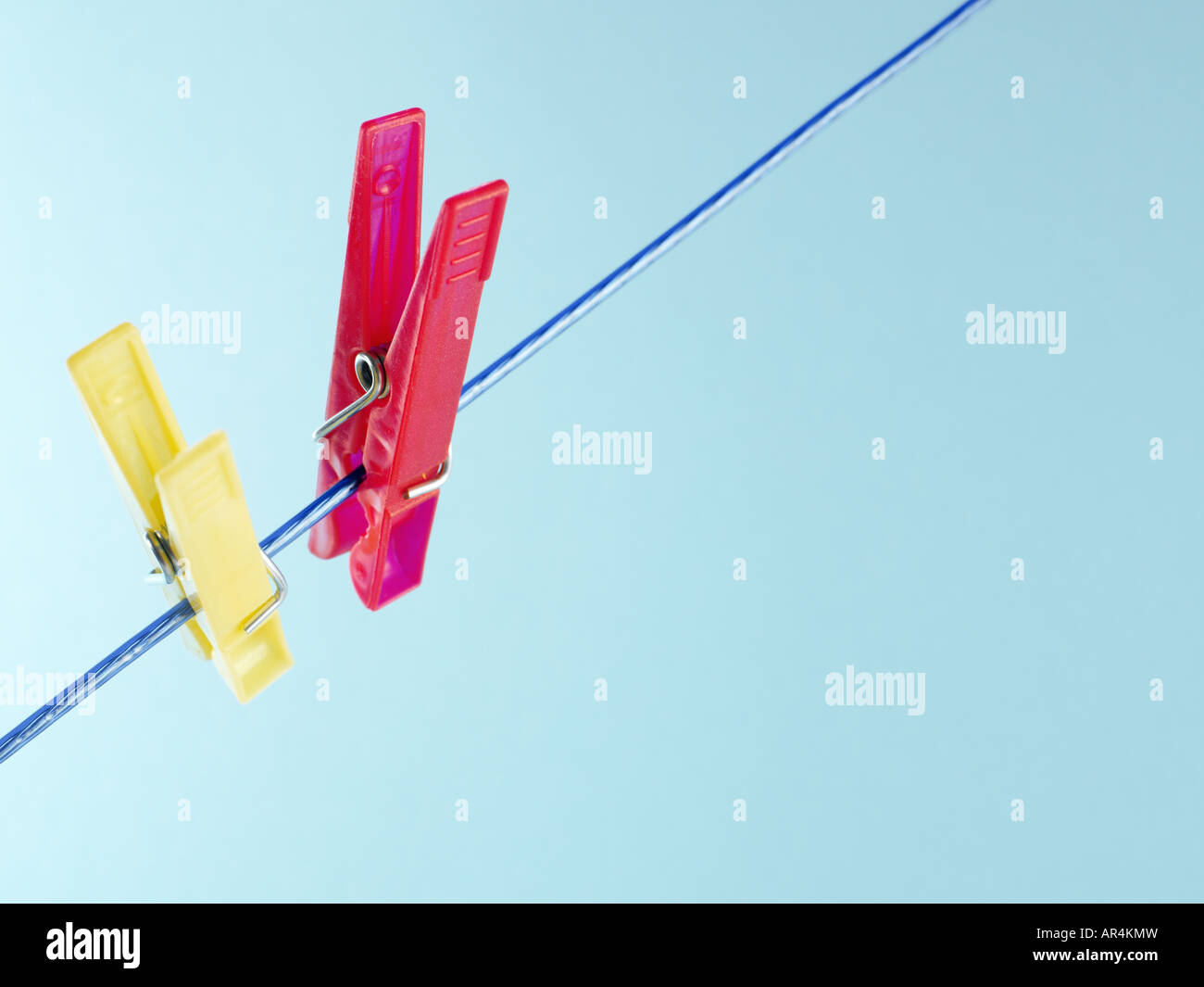 Clothes pegs on washing line Stock Photo - Alamy