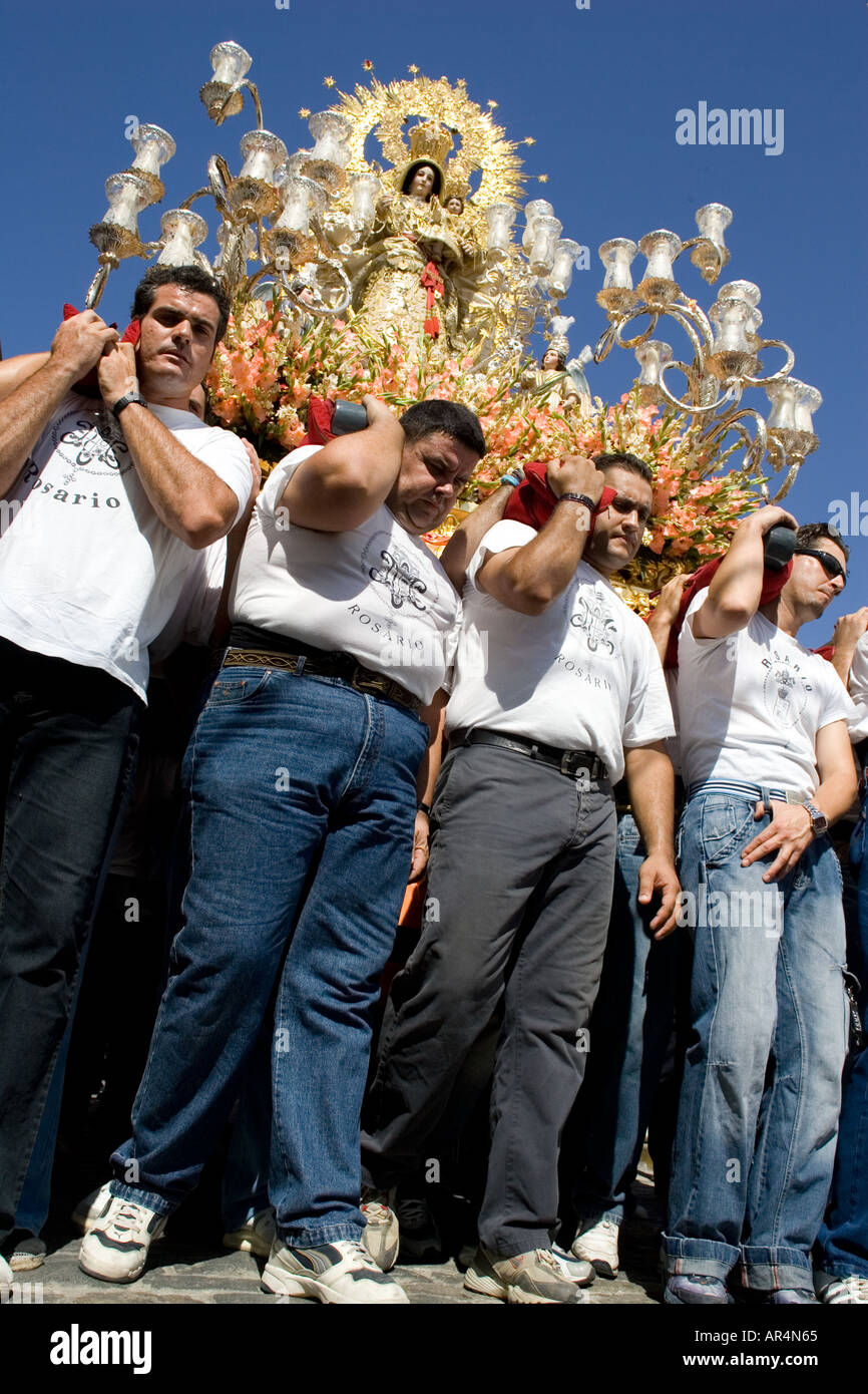 Men bearing Virgin image Stock Photo - Alamy