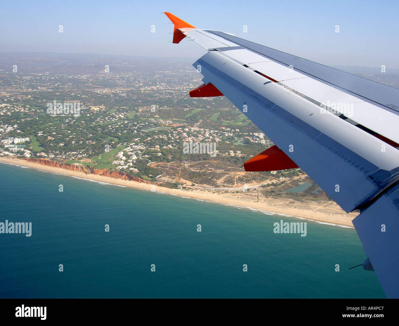 Modern jet approaching Faro airport Algarve Portugal with Val do lobo ...