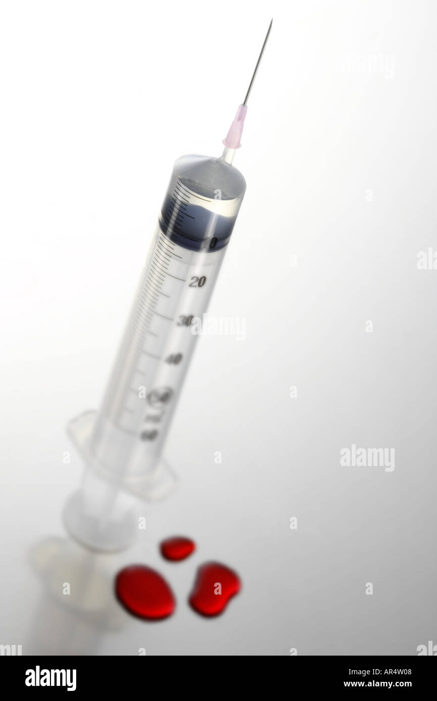 Syringe with blood drops Stock Photo - Alamy
