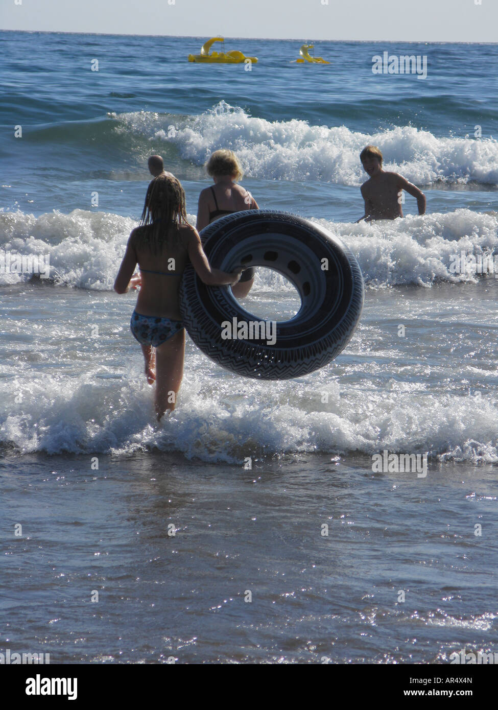 Bathers in the atlantic ocean Stock Photo - Alamy