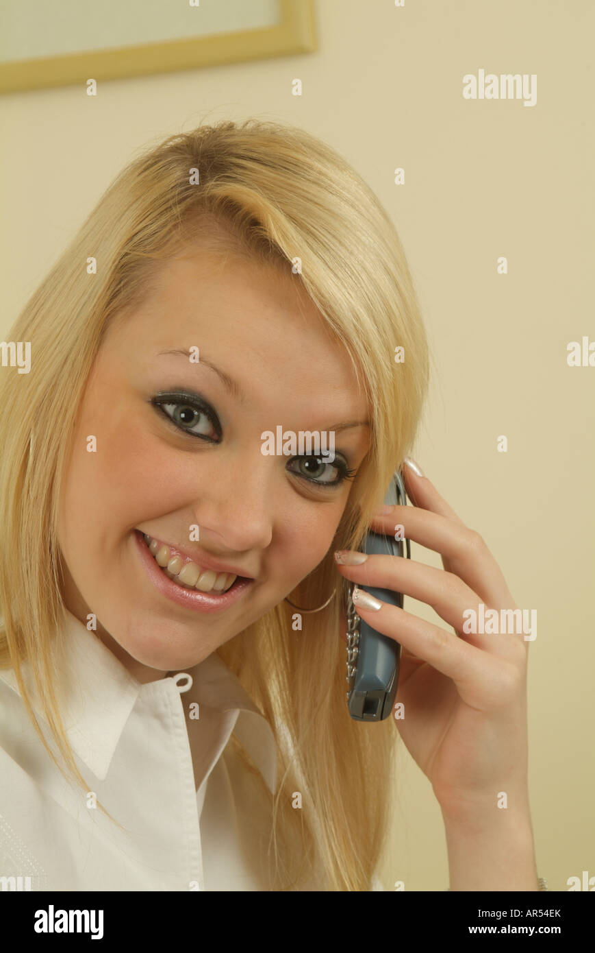 A portrait picture of a girl speaking on a telephone handset Stock ...
