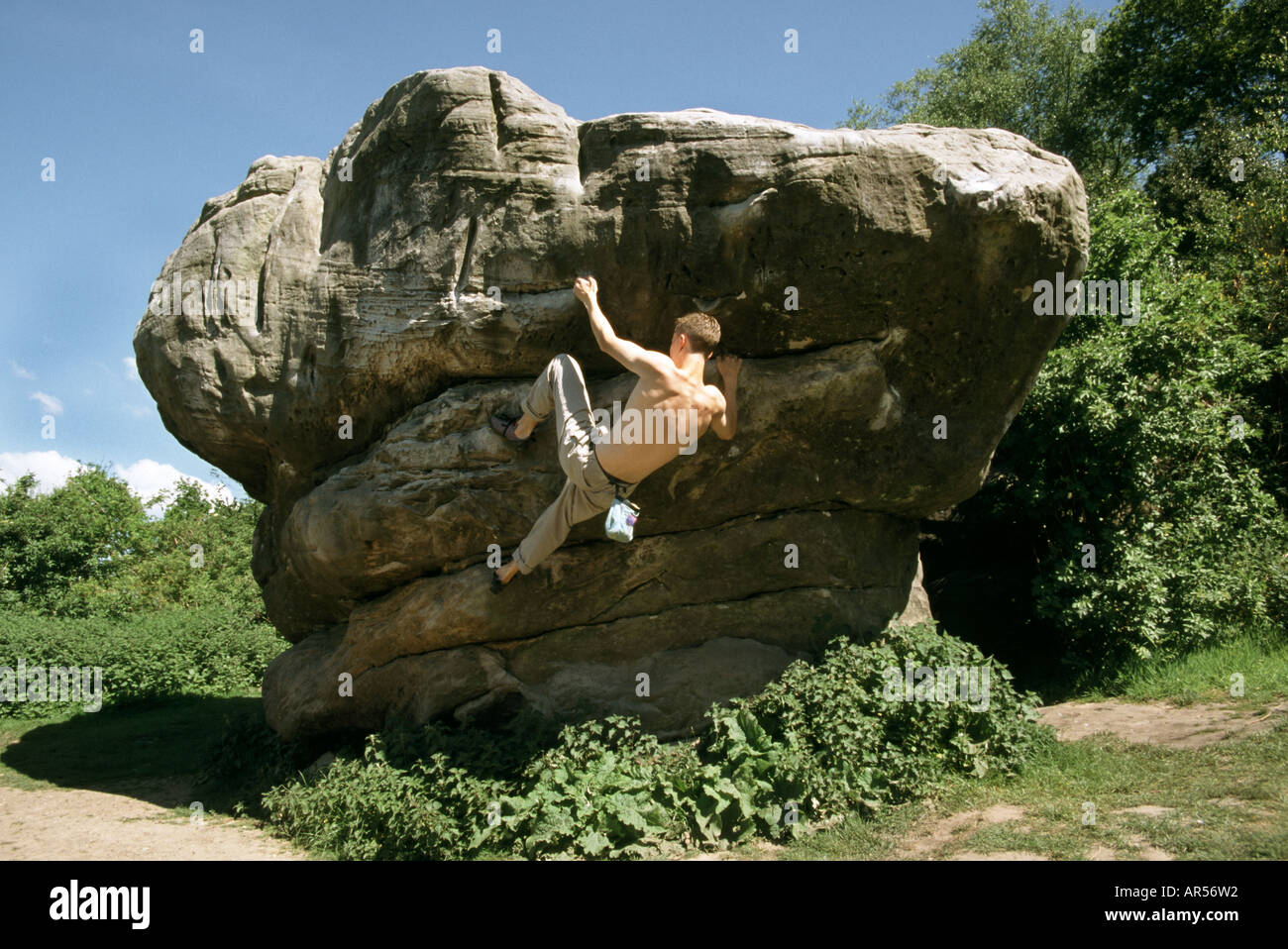 A climber bouldering at the North Boulder, of the sandstone crag ...