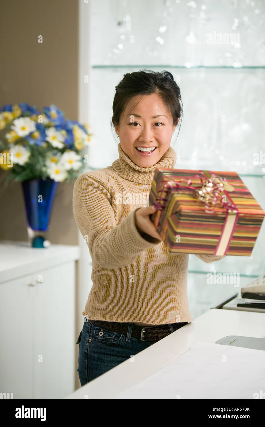 Female shopping assistant offering hi-res stock photography and images ...