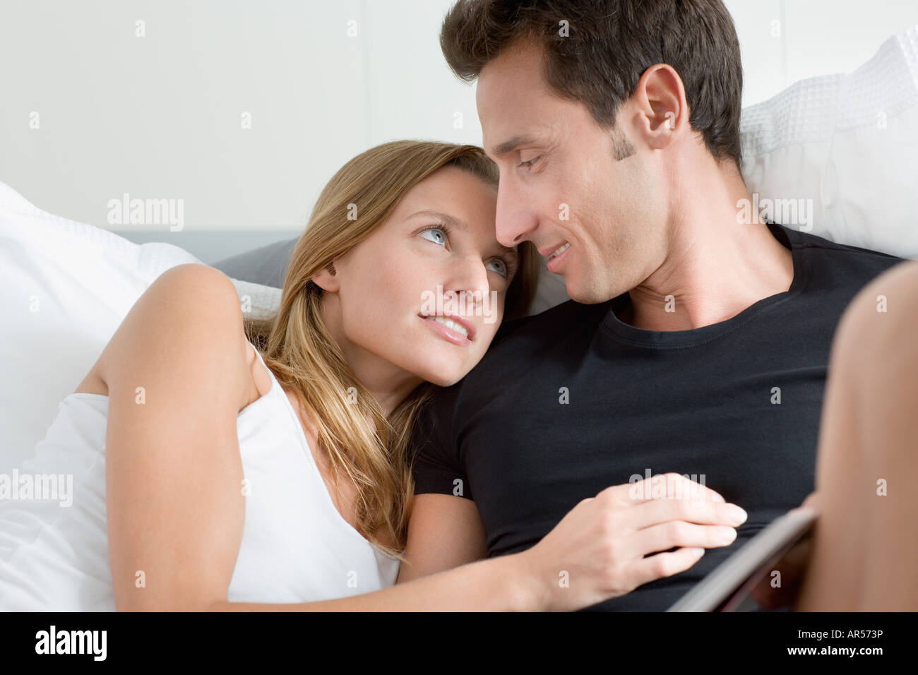Relaxed young couple reclining hi-res stock photography and images - Alamy
