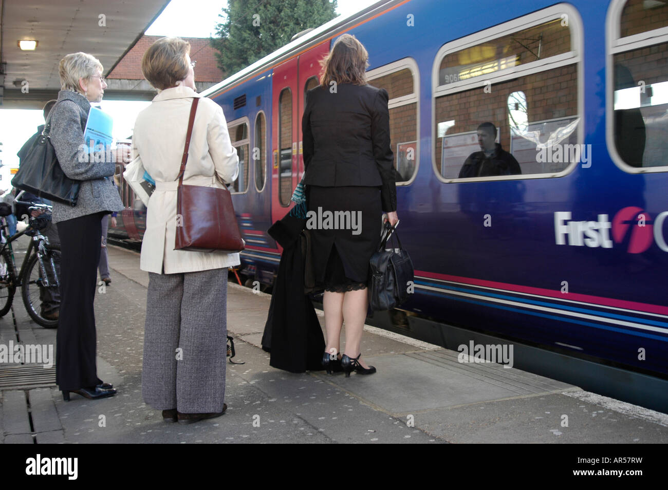 Passengers waiting to board a first capital connect train at a railway ...